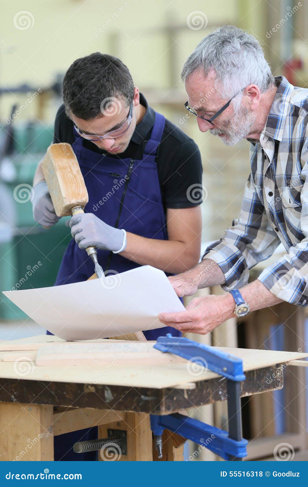 Young Apprentice with Instructor Working on Wood Stock Photo - Image of ...