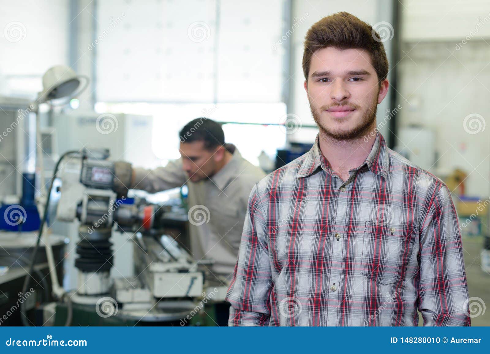 Young Apprentice Looking at Camera Stock Photo - Image of woodwork ...