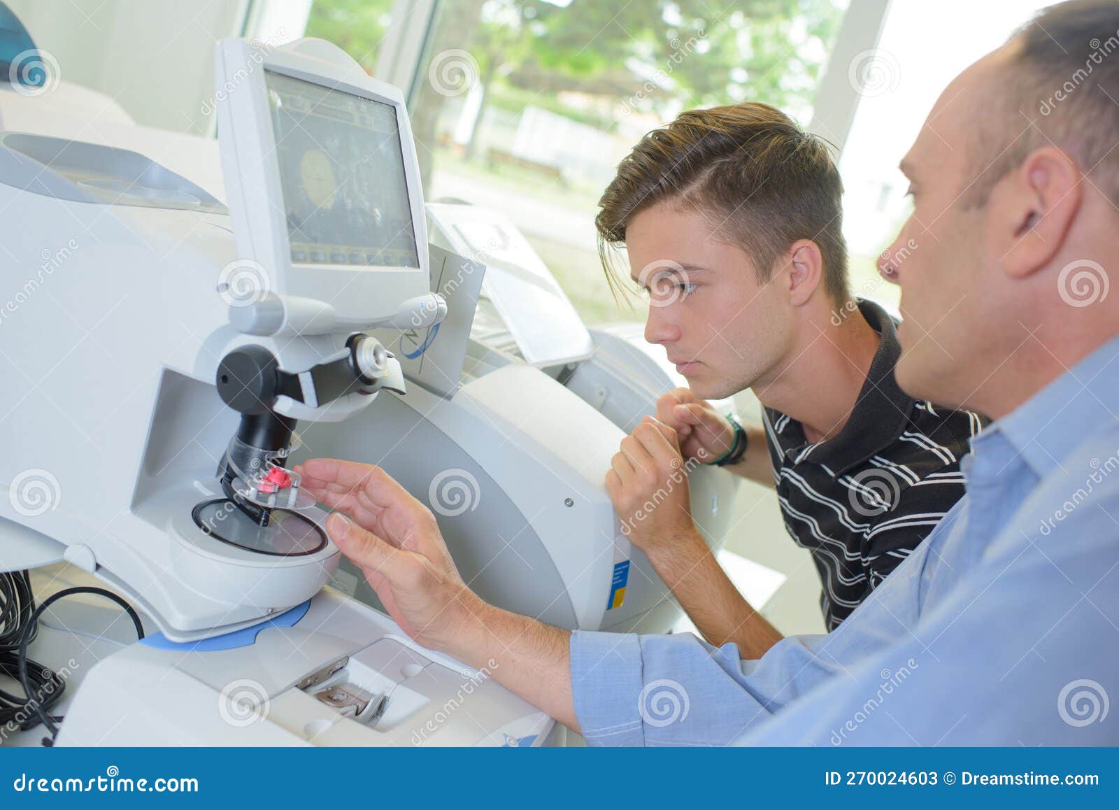 Young Apprentice and Optician with Optical Instruments Stock Image ...