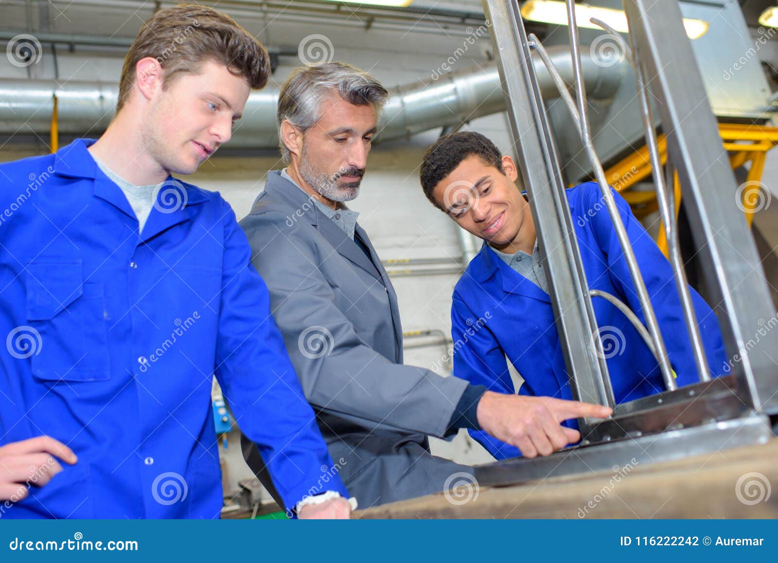 Young Apprentice with Professional Metallurgist Stock Photo - Image of ...