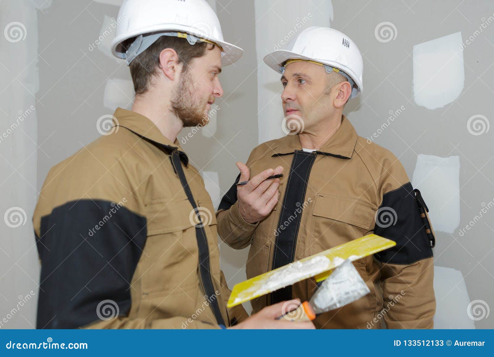 Young Apprentice with Professional Plasterer Stock Image - Image of ...