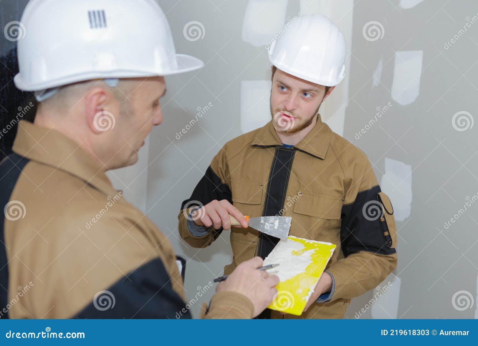 Young Apprentice with Professional Plasterer Stock Image - Image of ...