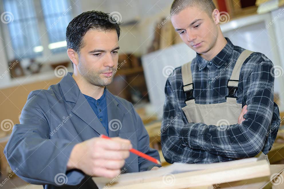 Young Apprentice with Teacher Working on Piece Wood Stock Photo - Image ...