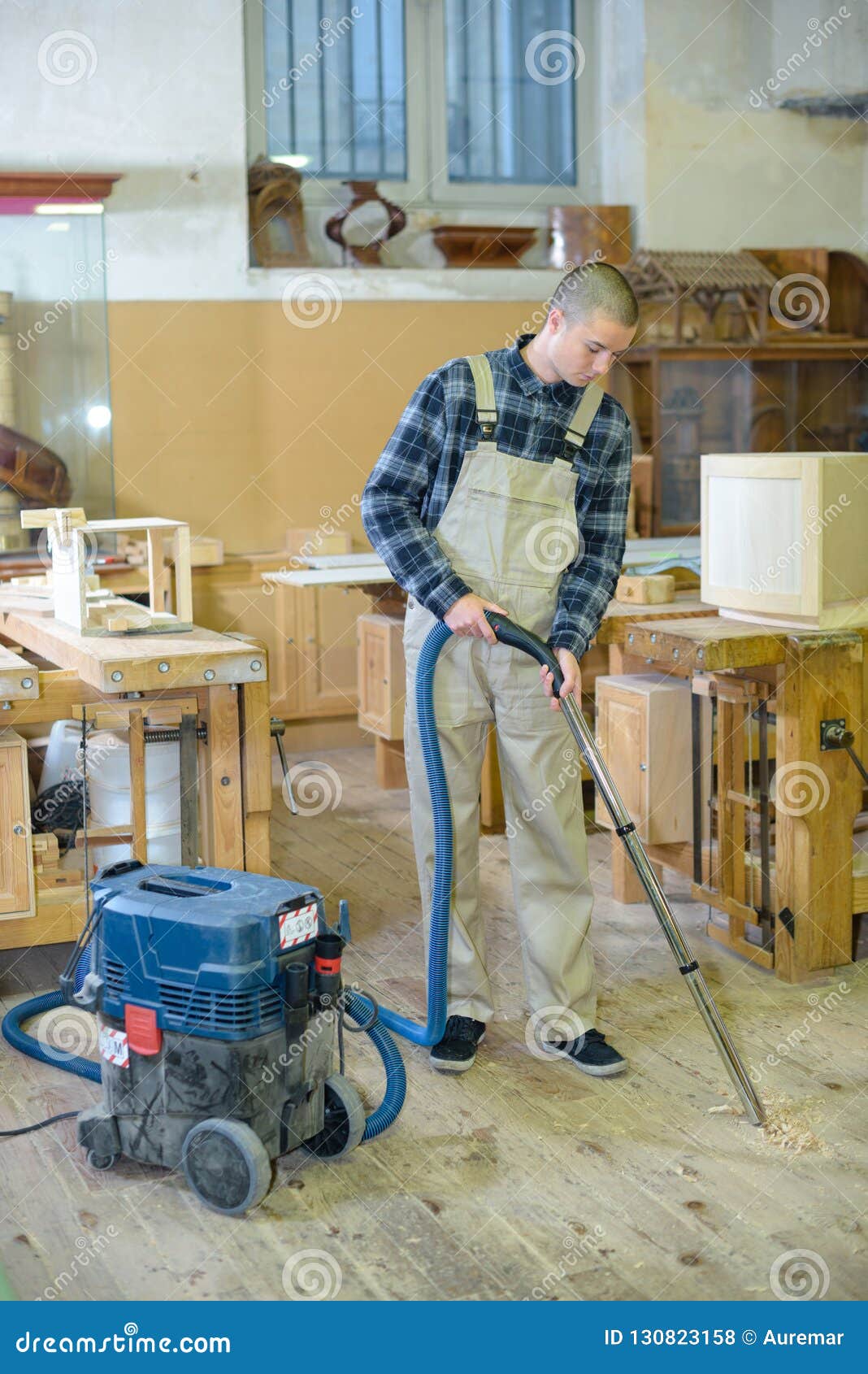 Young Apprentice Tidying Workshop Stock Photo - Image of cleaner ...
