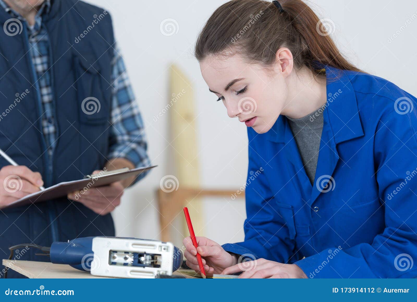 Young Apprentice Woman Working in Workshop Stock Photo - Image of ...