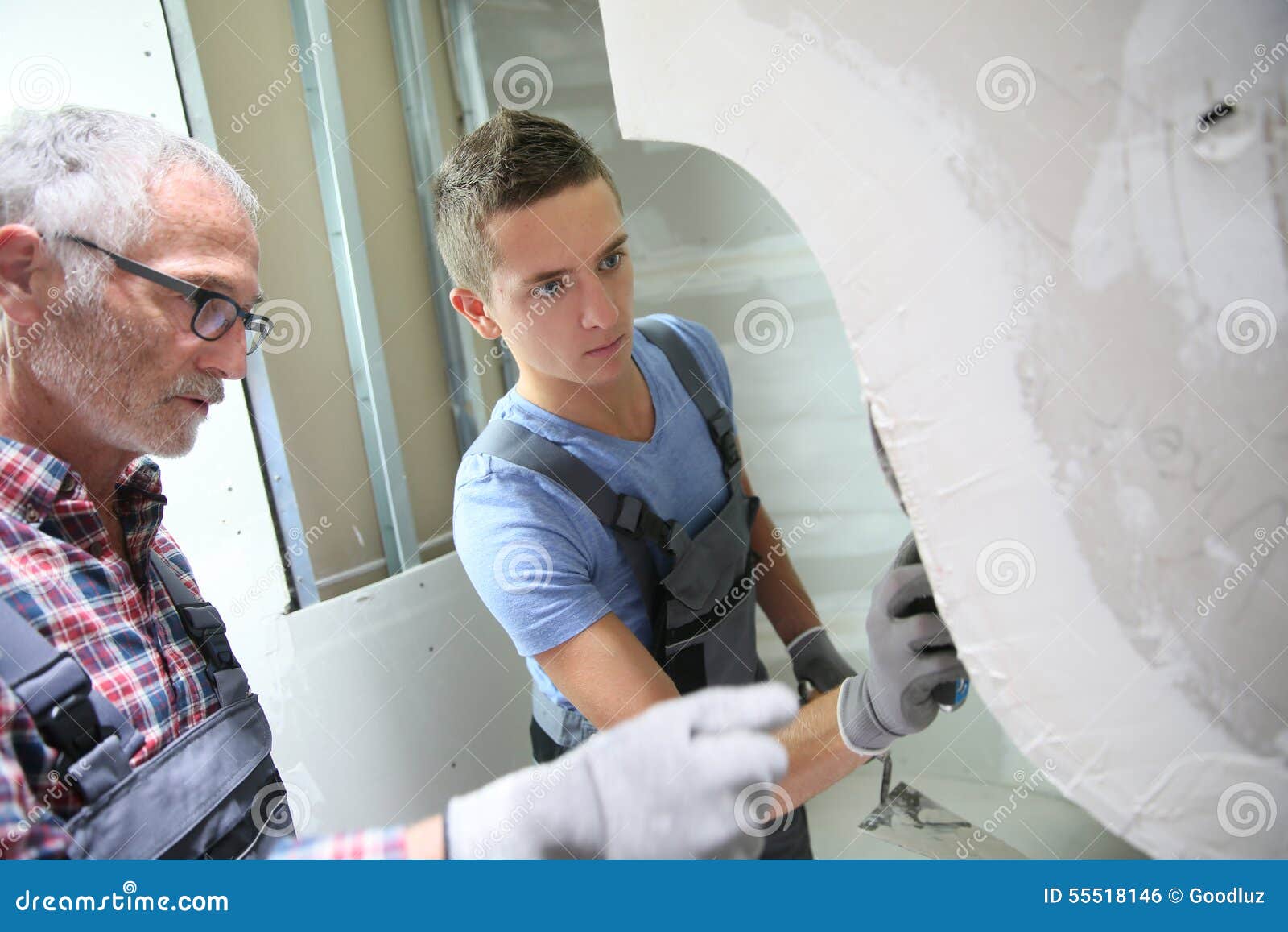 Young Apprentice Working on Inddor Wall Stock Photo - Image of ...