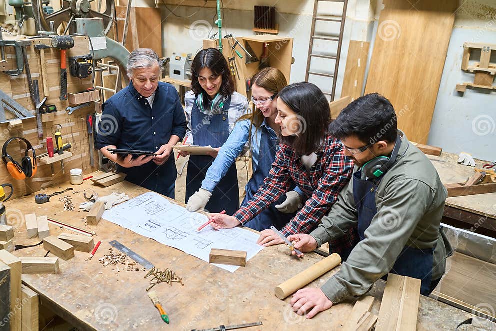 Young Apprentices Learning Carpentry Skills in a Collaborative Workshop ...
