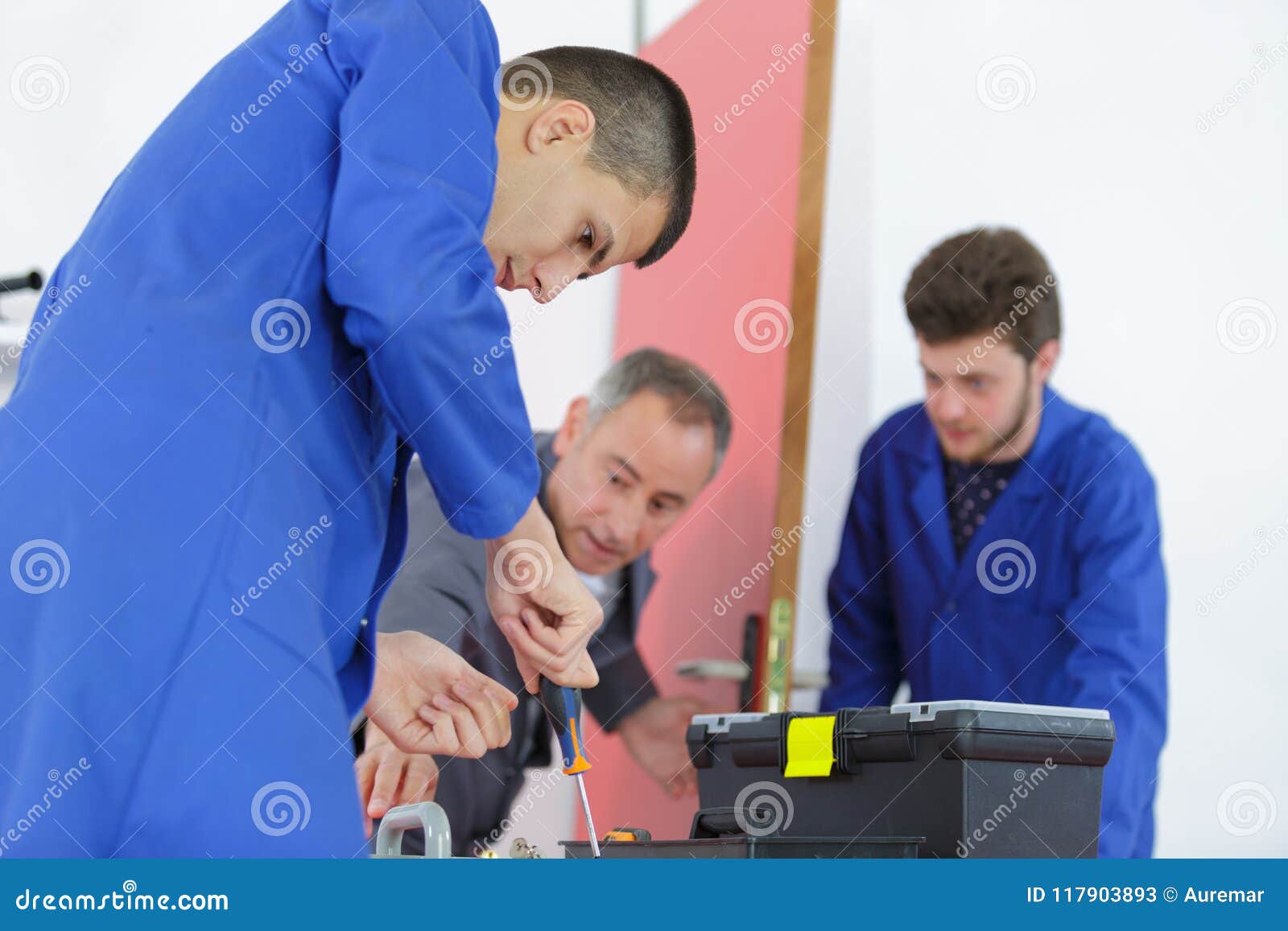 Young Apprentices with Mentor Stock Image - Image of secure, assessment ...