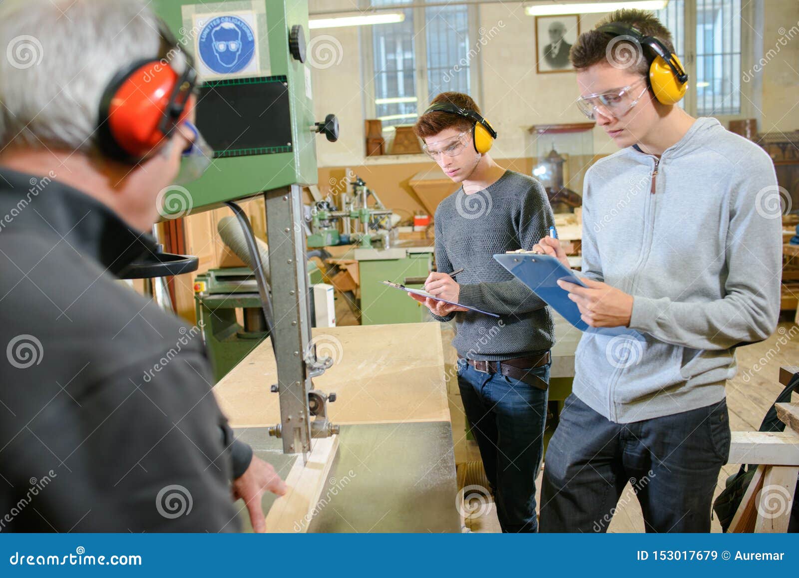 Young Apprentices Protecting Ears from Noisy Machinery Stock Image ...