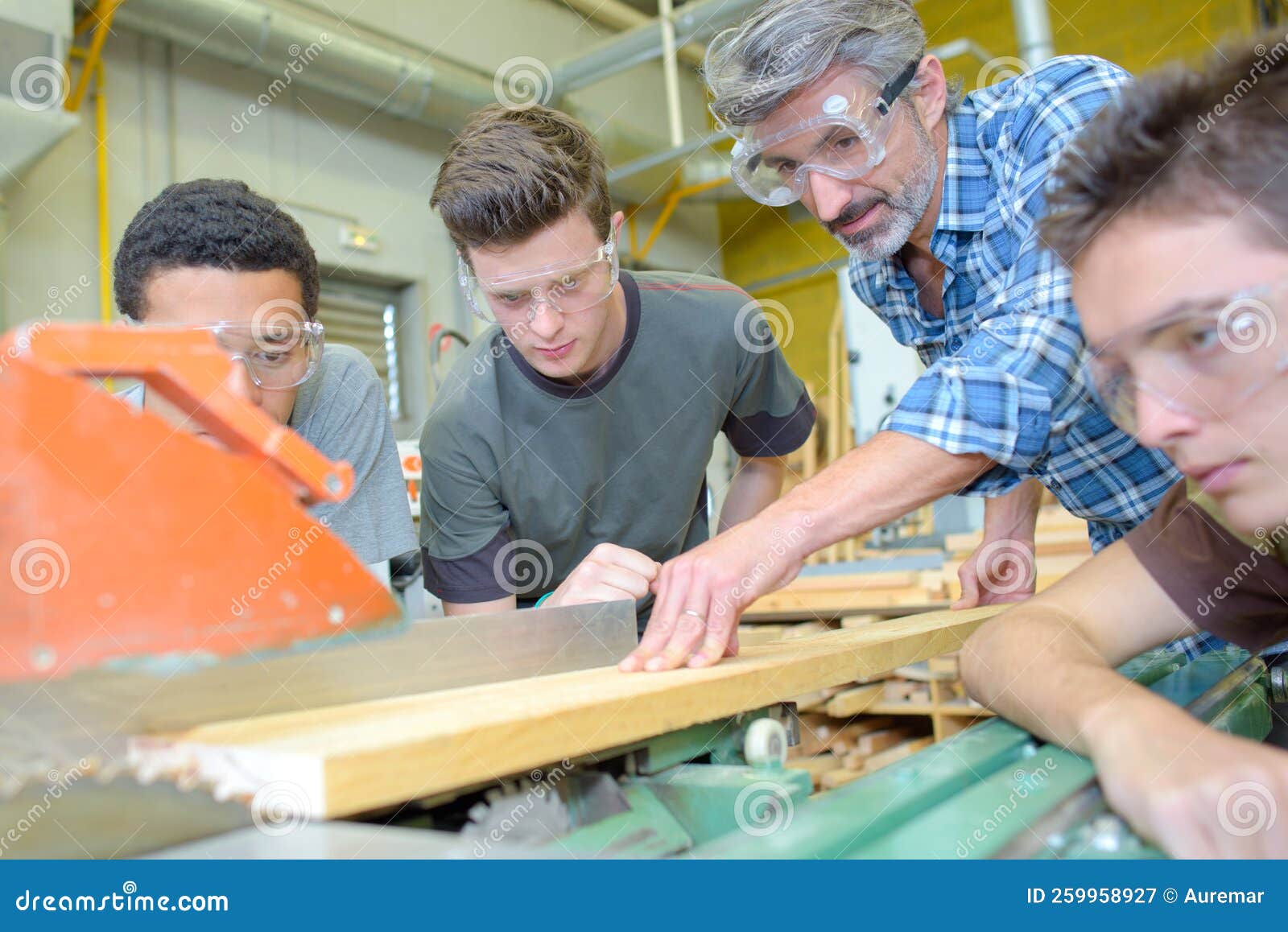 Young Apprentices Using Electric Saw Stock Image - Image of mentor ...
