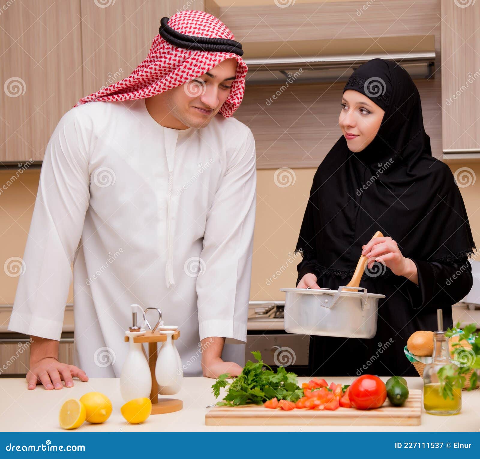 Young Arab Family in the Kitchen Stock Image - Image of helping, female ...