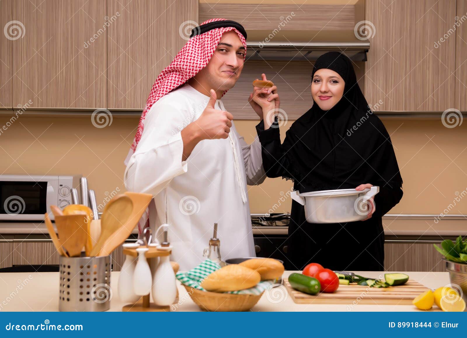 The Young Arab Family in the Kitchen Stock Photo - Image of couple ...