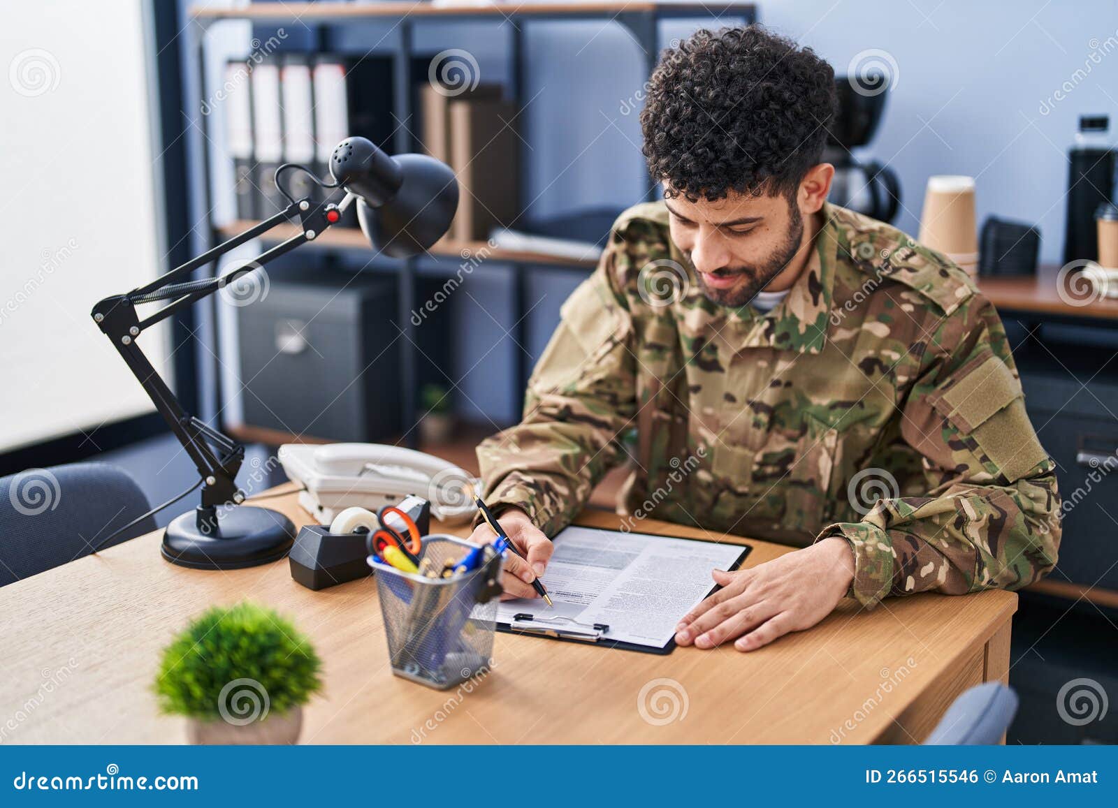 Young Arab Man Army Soldier Signing Contract at Office Stock Photo ...