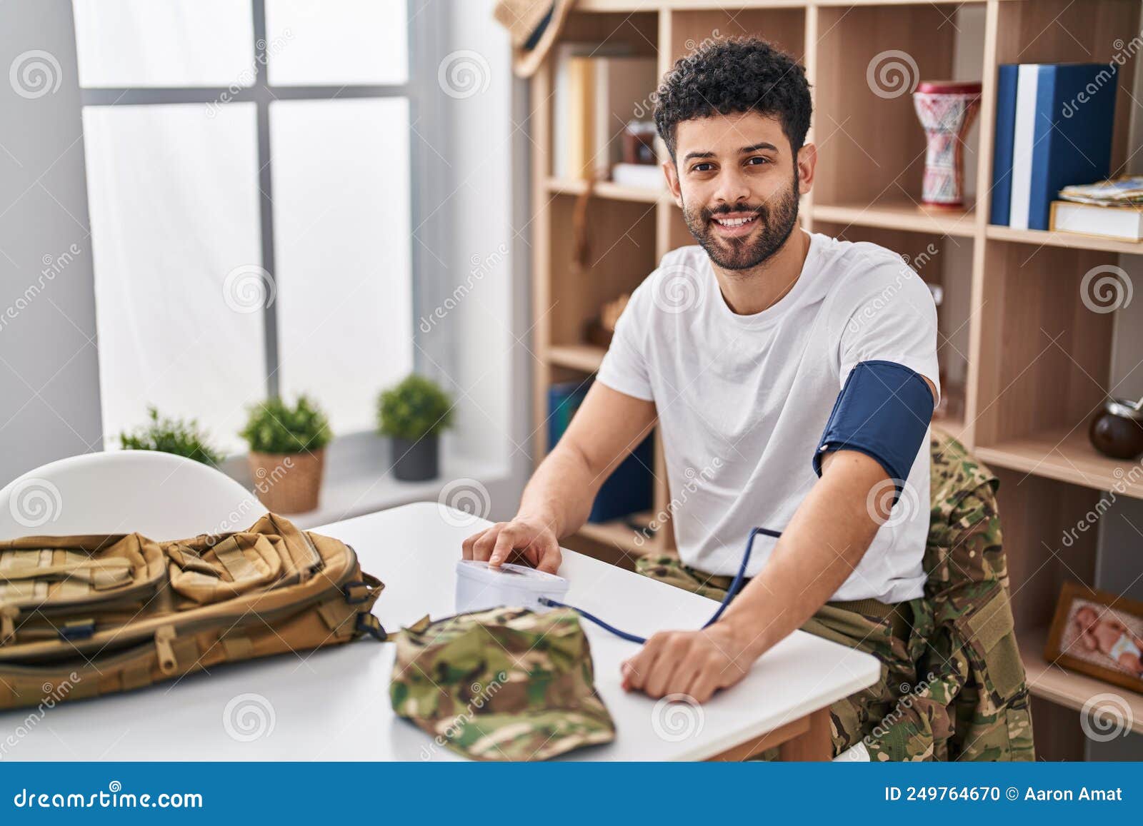 Young Arab Man Army Soldier Using Tensiometer at Home Stock Photo ...