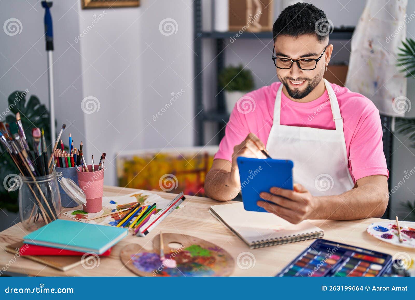 Young Arab Man Artist Drawing on Notebook Using Touchpad at Art Studio ...