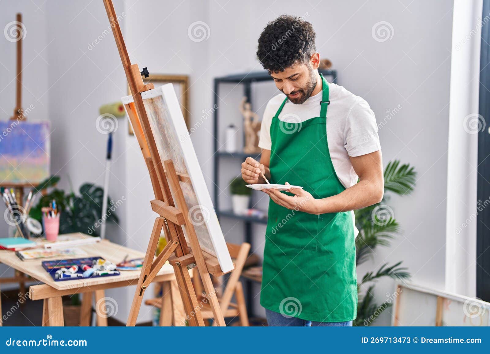Young Arab Man Artist Smiling Confident Drawing at Art Studio Stock ...