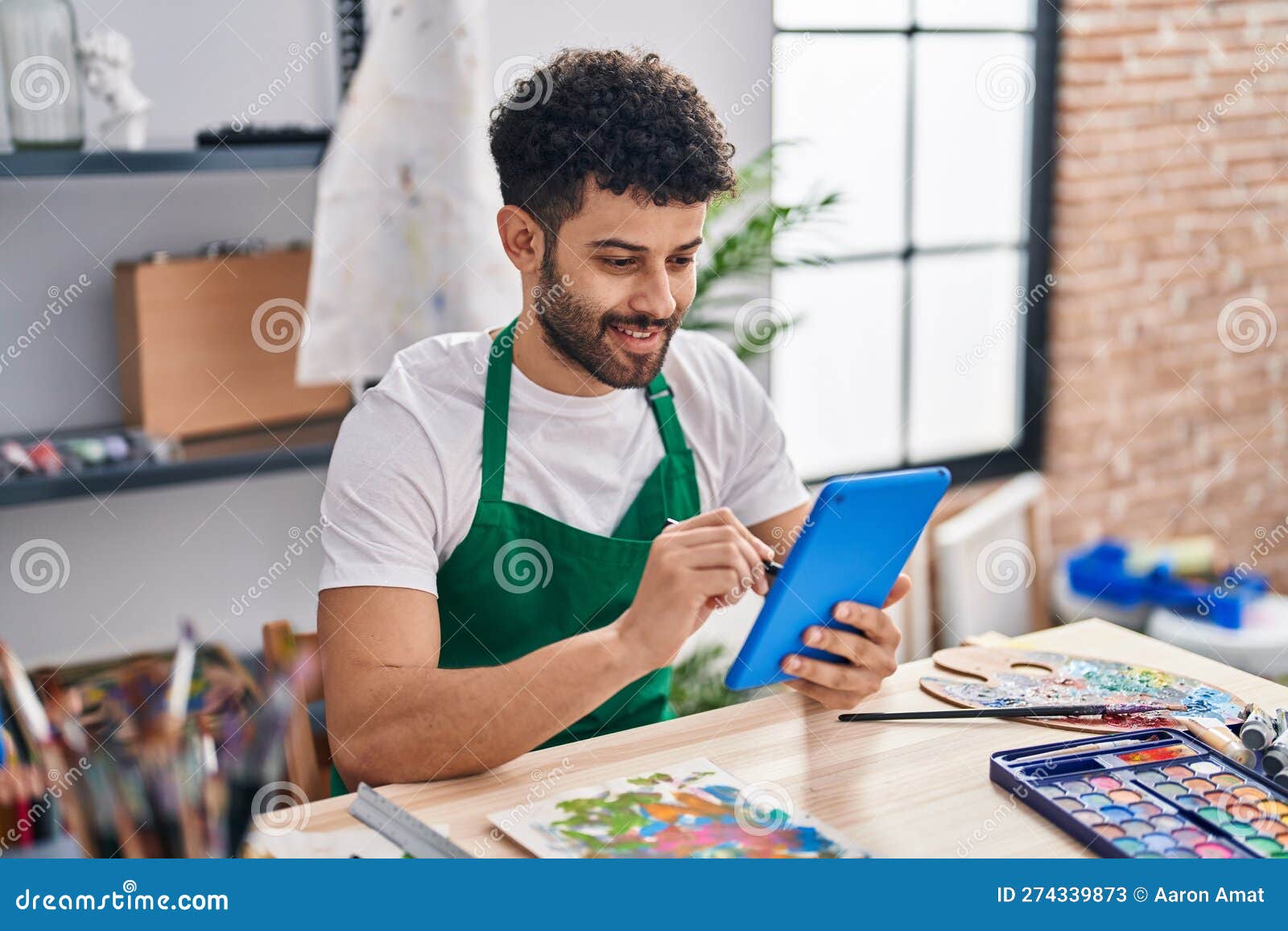 Young Arab Man Artist Smiling Confident Using Touchpad at Art Studio ...