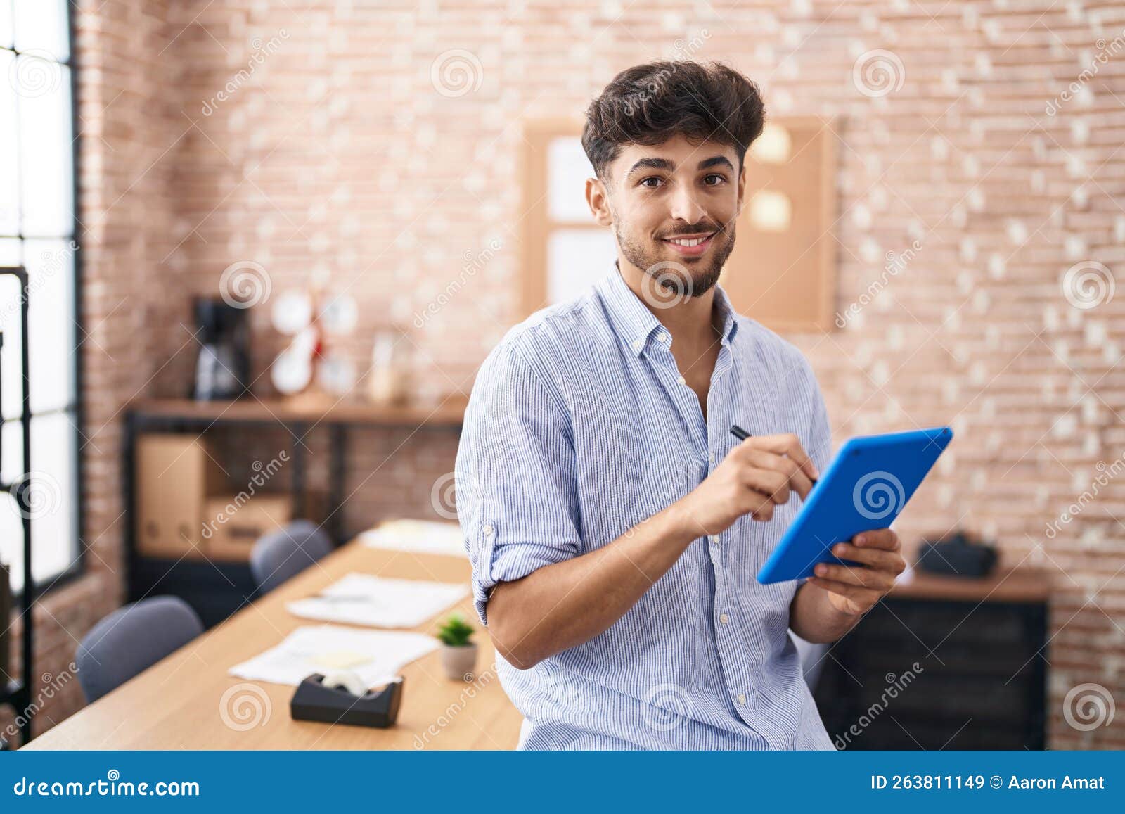 Young Arab Man Business Worker Writing on Touchpad at Office Stock ...