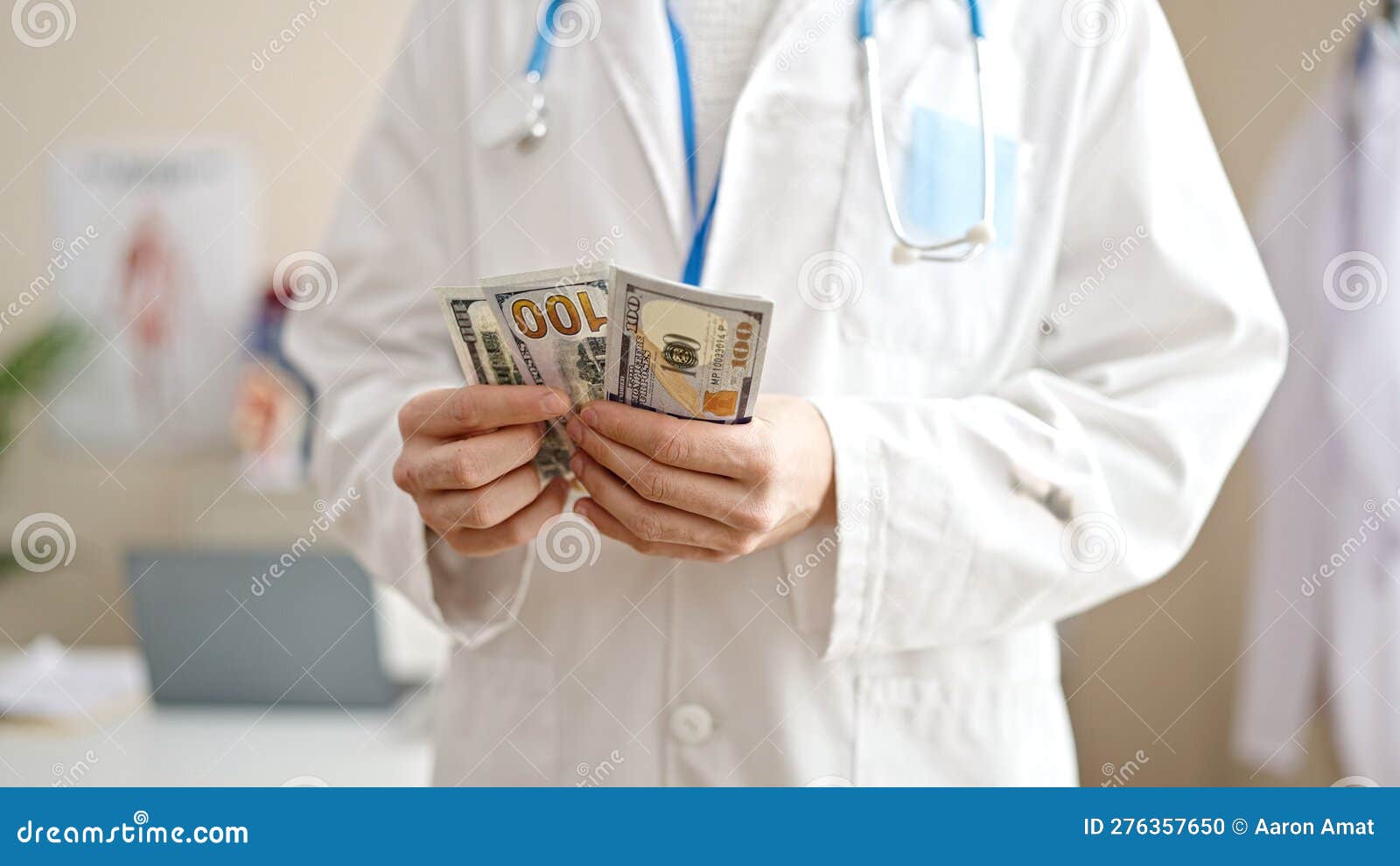 Young Arab Man Doctor Counting Dollars at Clinic Stock Photo - Image of ...