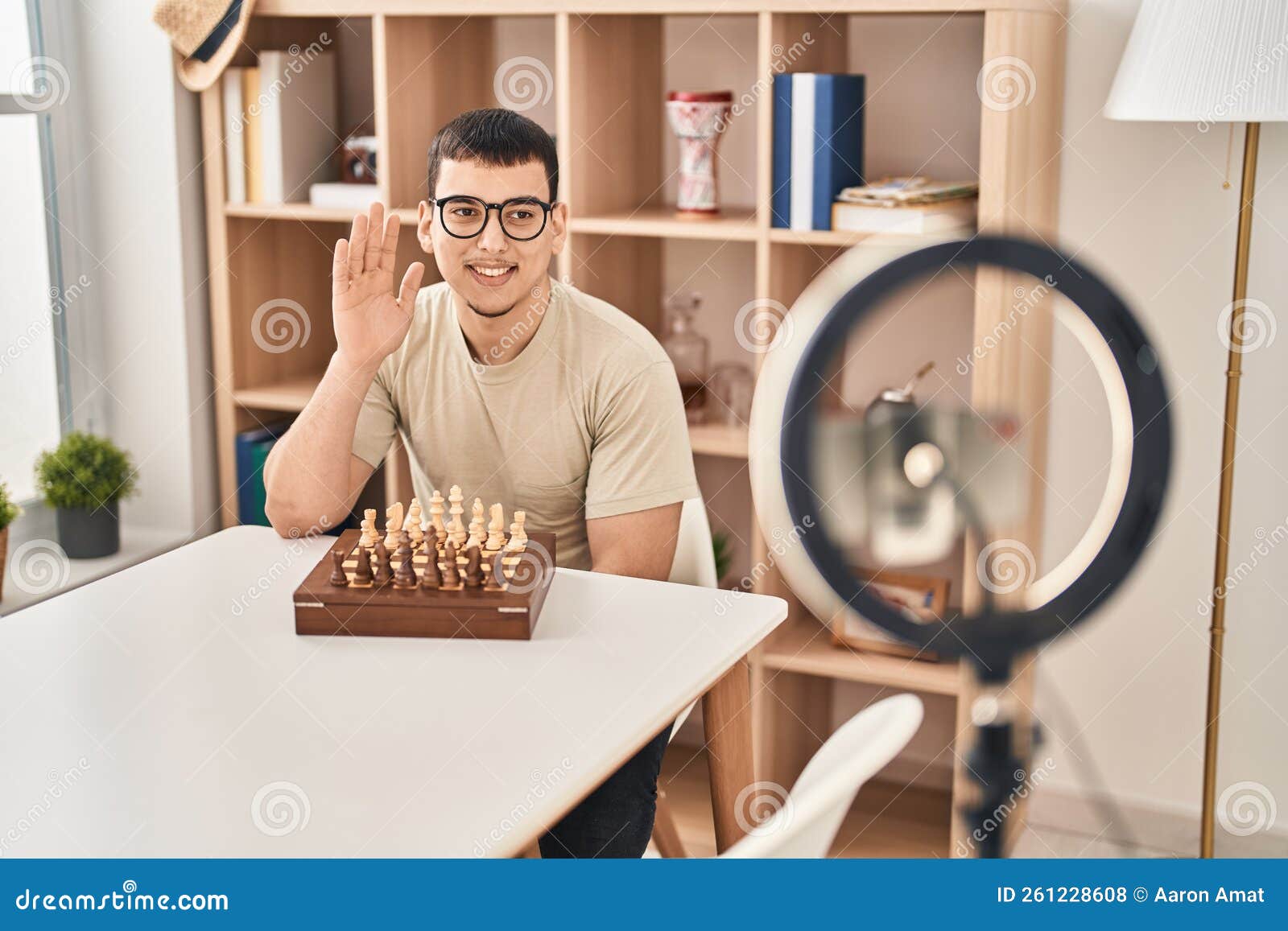 Young Arab Man Doing Chess Tutorial Looking Positive and Happy Standing ...