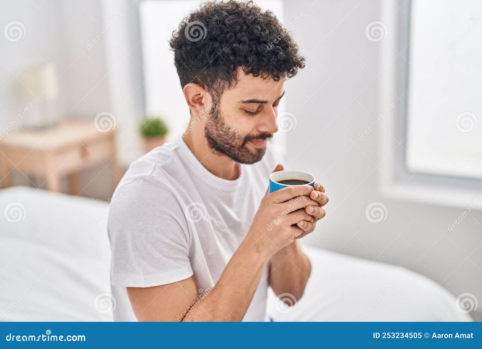 Young Arab Man Drinking Cup of Coffee Sitting on Bed at Bedroom Stock ...