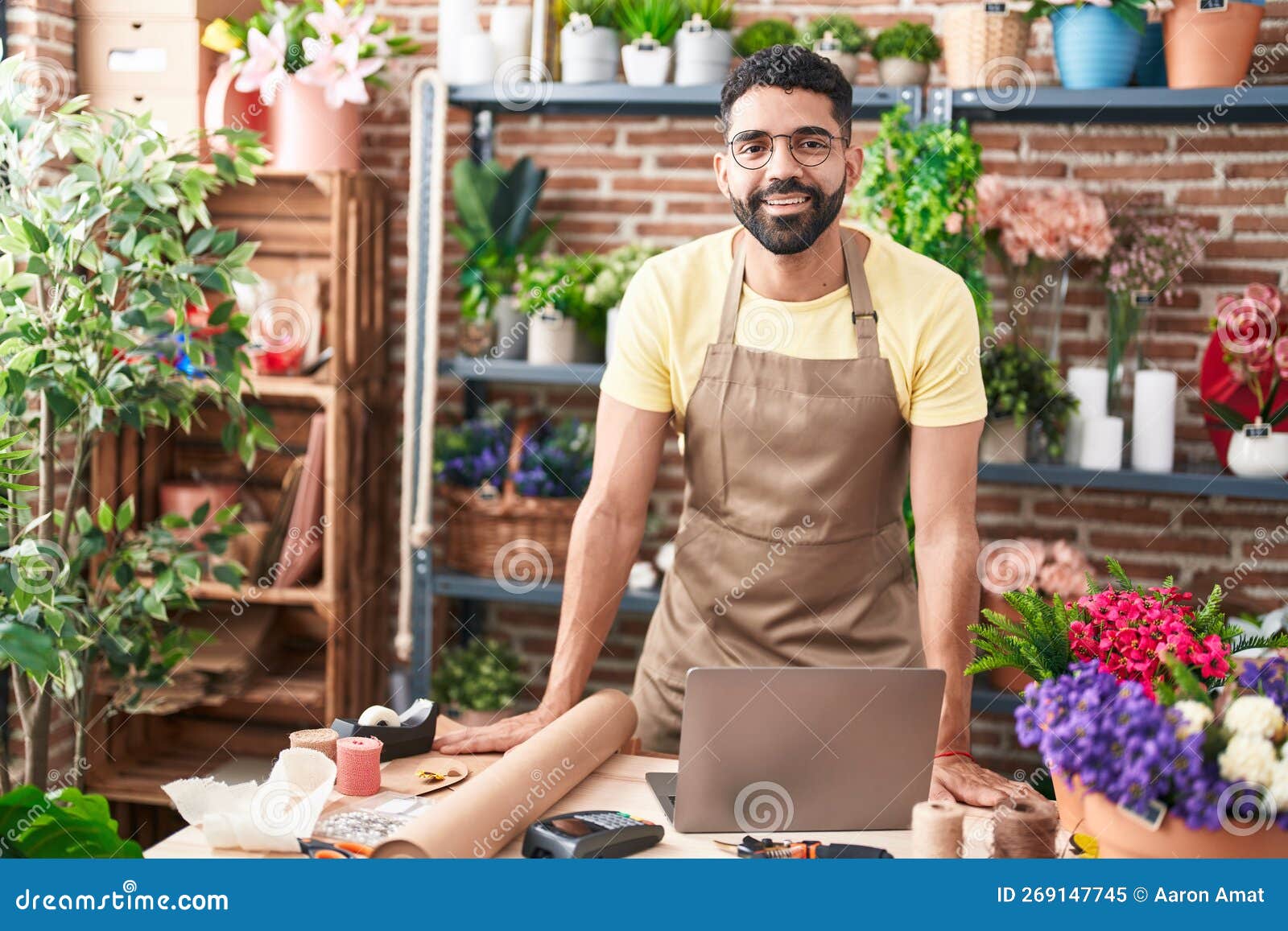 Young Arab Man Florist Smiling Confident Standing at Florist Stock ...