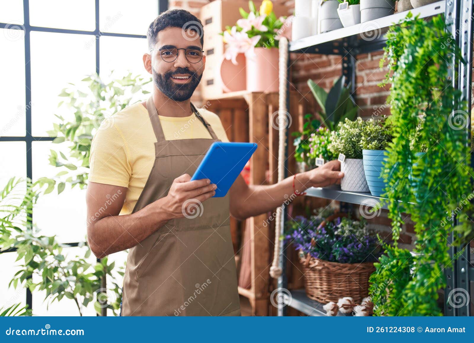 Young Arab Man Florist Smiling Confident Using Touchpad at Florist ...