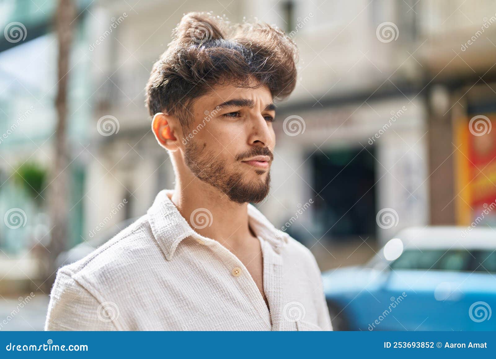 Young Arab Man Looking To the Side with Relaxed Expression at Street ...