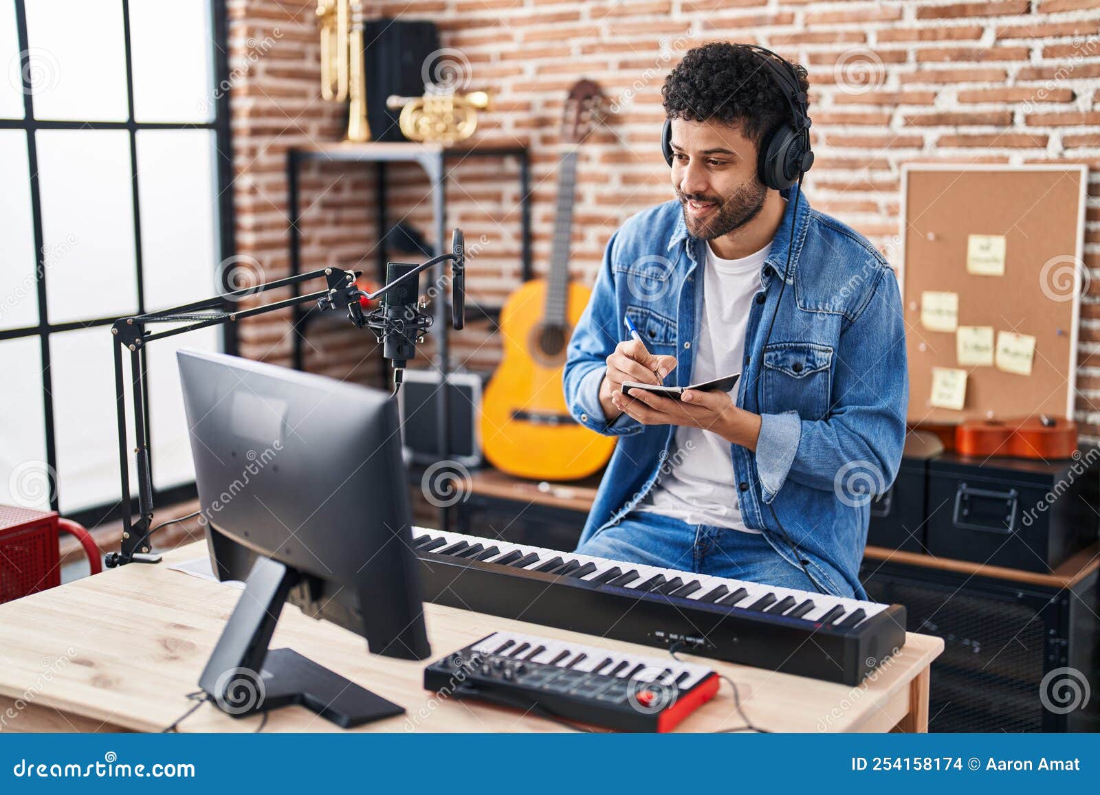 Young Arab Man Musician Composing Song at Music Studio Stock Photo ...