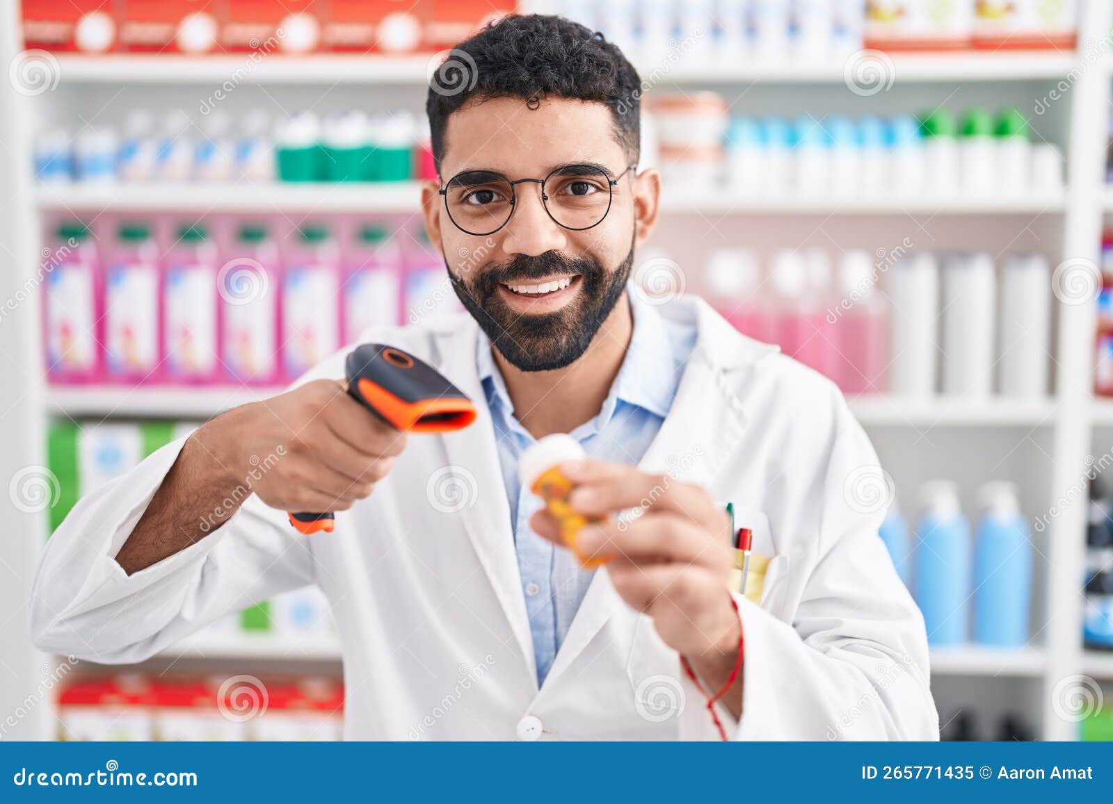 Young Arab Man Pharmacist Scanning Pills Bottle at Pharmacy Stock Image - Image of medical, drug ...