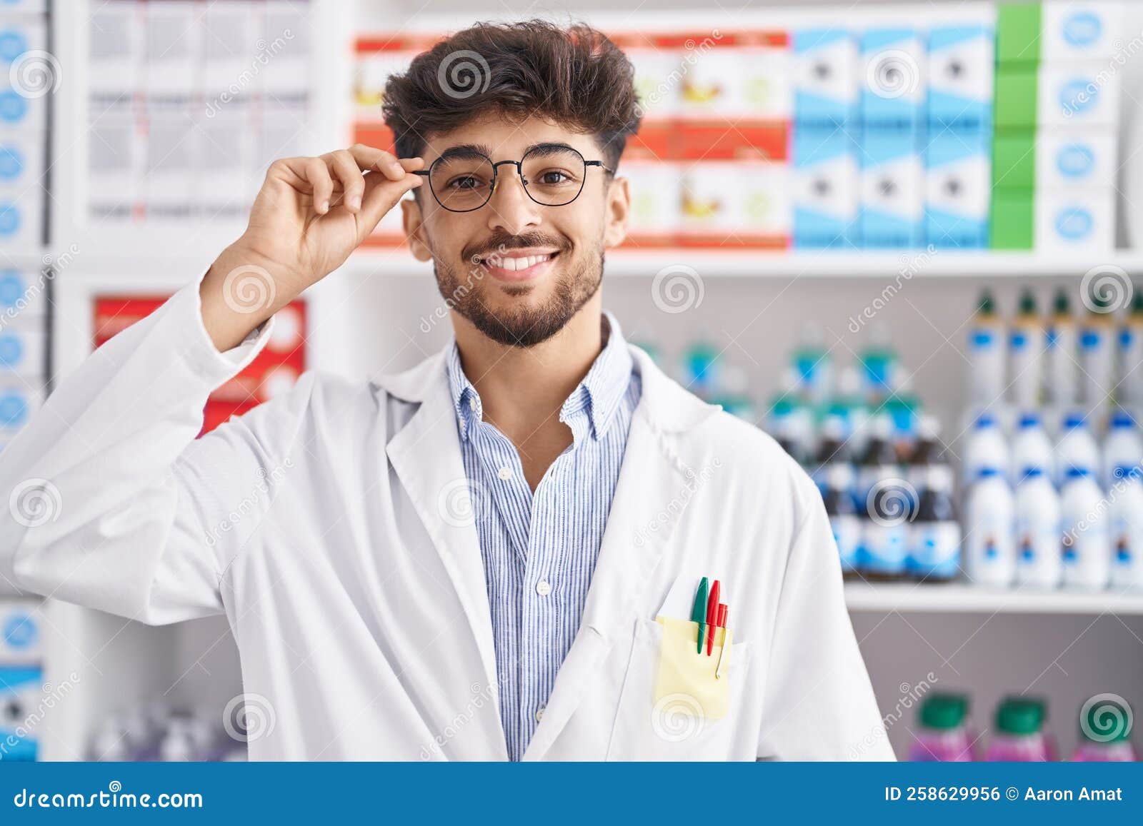 Young Arab Man Pharmacist Smiling Confident Standing at Pharmacy Stock ...