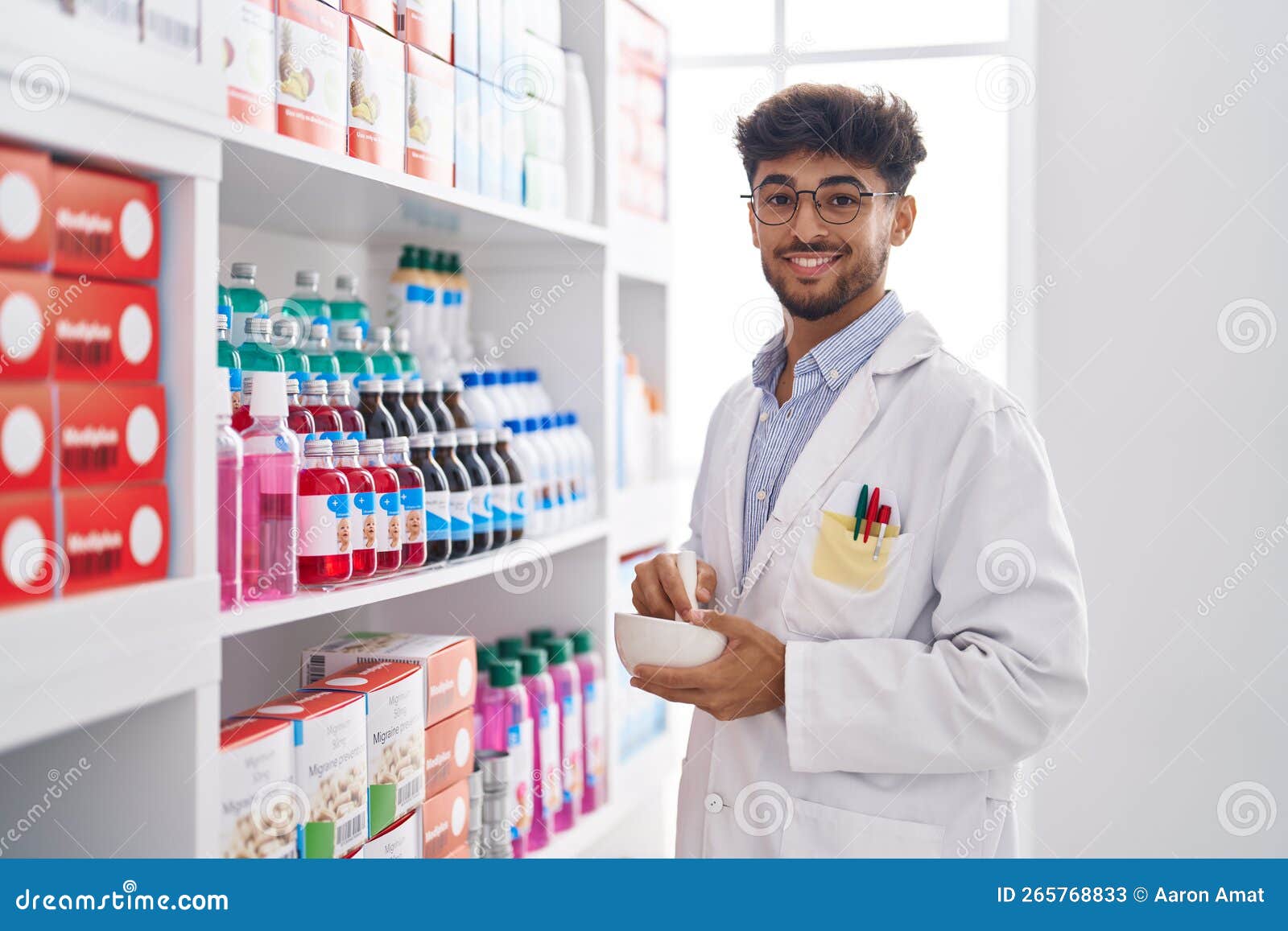 Young Arab Man Pharmacist Smiling Confident Working at Pharmacy Stock ...