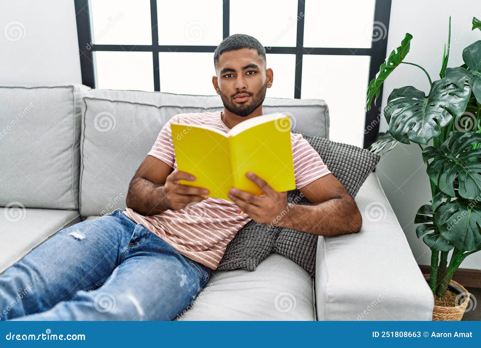 Young Arab Man Reading Book at Home Stock Image - Image of study, east ...