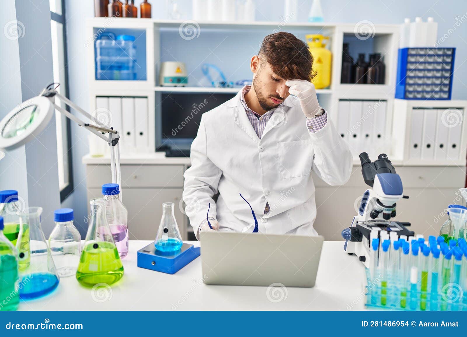 Young Arab Man Scientist Stressed Using Laptop Working at Laboratory ...
