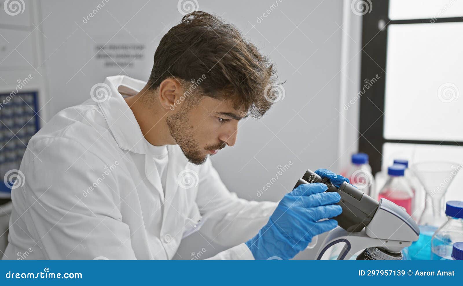 Young Arab Man Scientist Using Microscope at Laboratory Stock Image ...