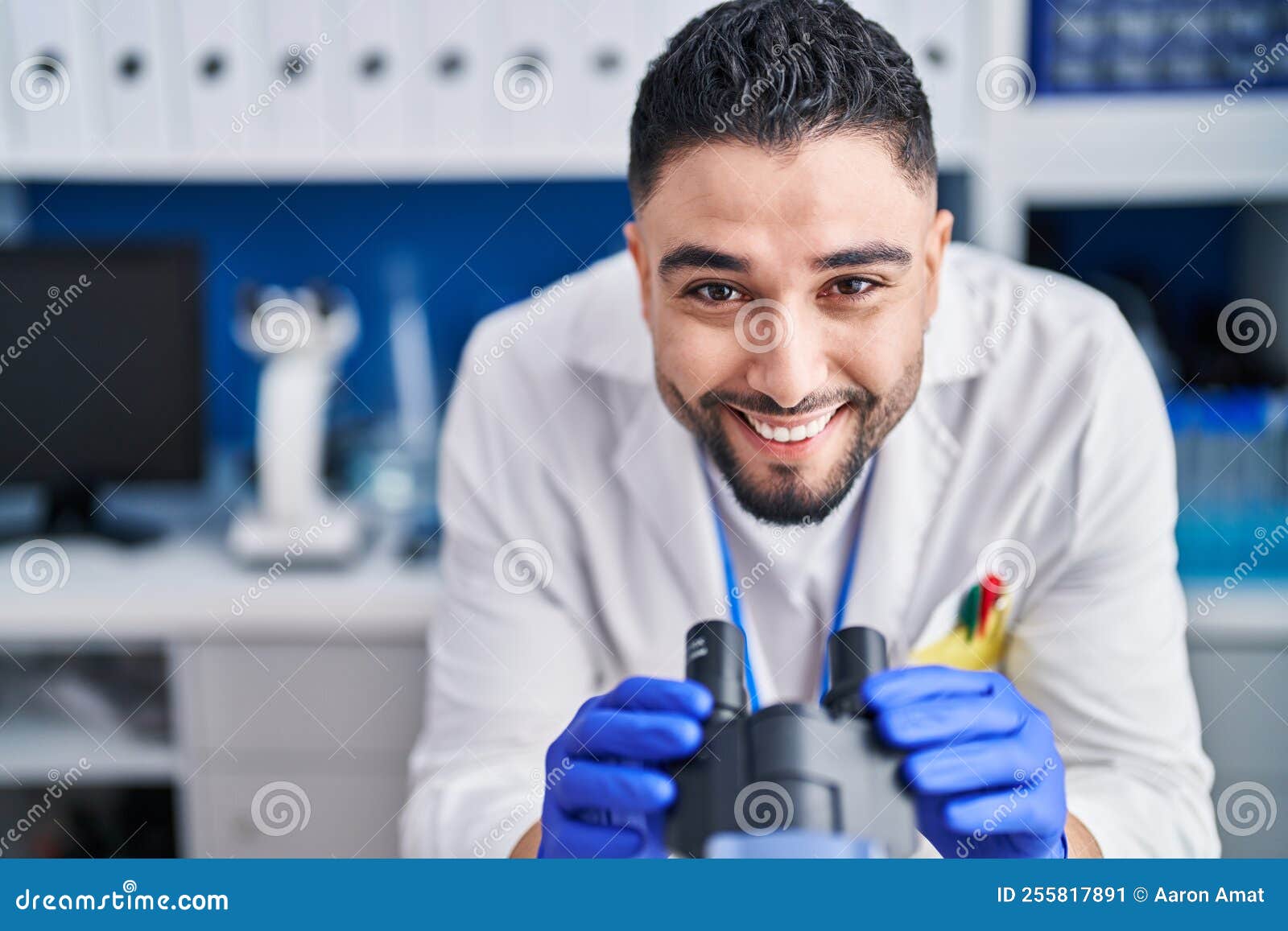 Young Arab Man Scientist Using Microscope Working at Laboratory Stock ... Young Arab Man Scientist Using Microscope Working at Laboratory Stock ...