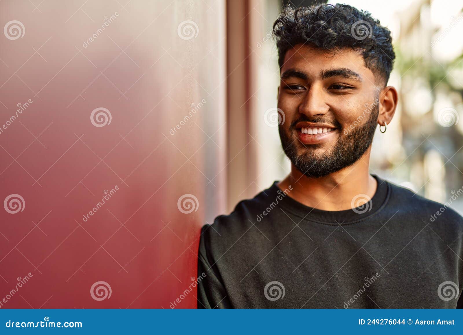 Young Arab Man Smiling Confident Leaning on the Wall at Street Stock ...