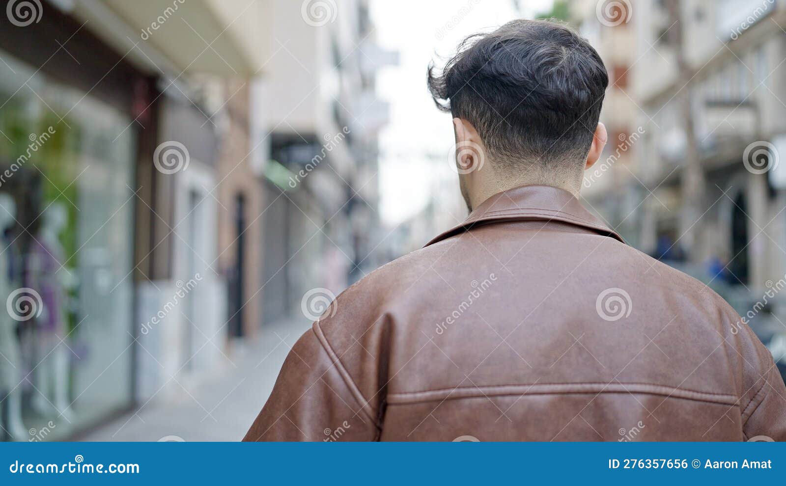 Young Arab Man Standing Backwards at Street Stock Photo - Image of ...