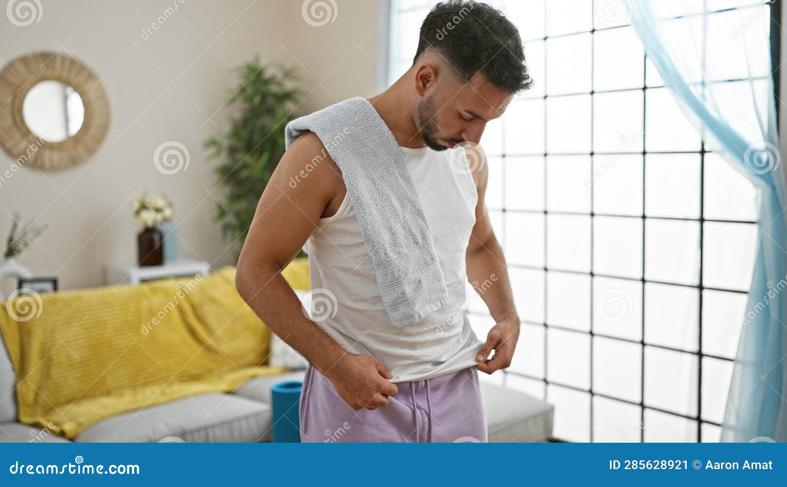 Young Arab Man Standing Tired Using Towel Sweating at Home Stock Image ...