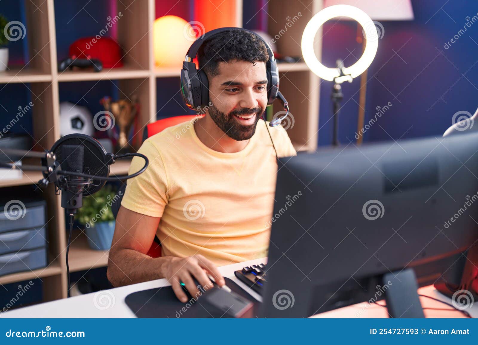 Young Arab Man Streamer Playing Video Game Using Computer at Gaming ...