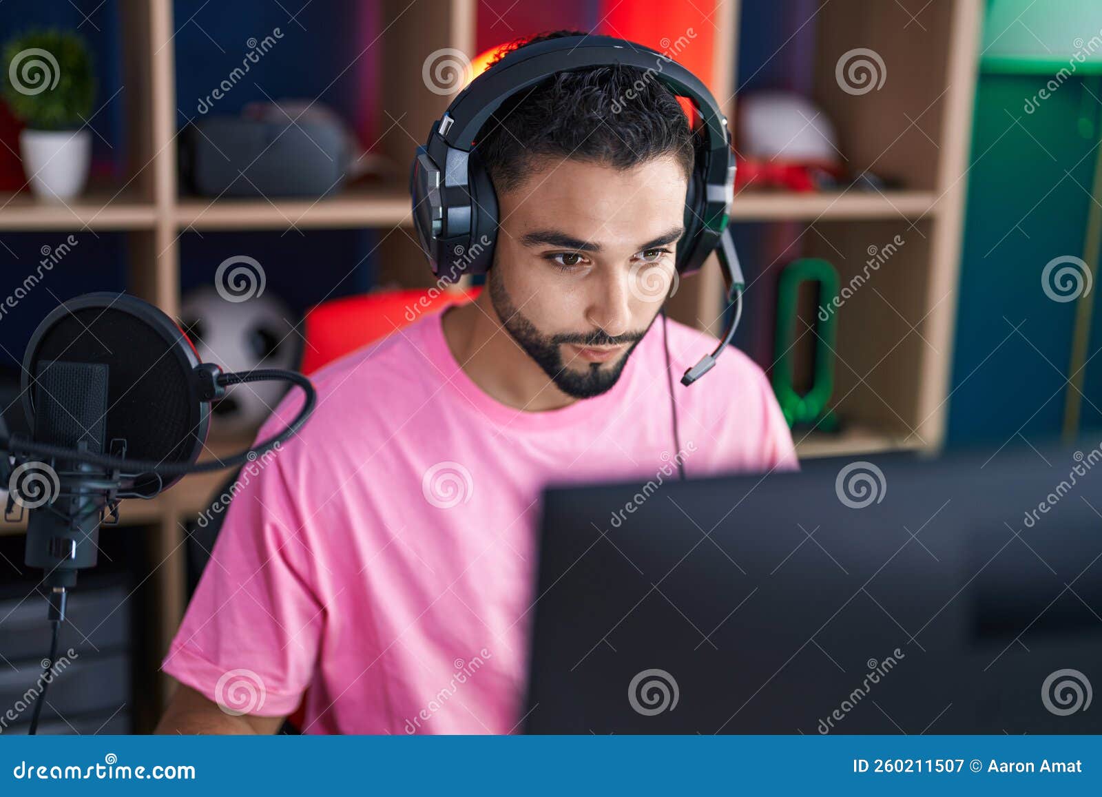 Young Arab Man Streamer Playing Video Game Using Computer at Gaming ...