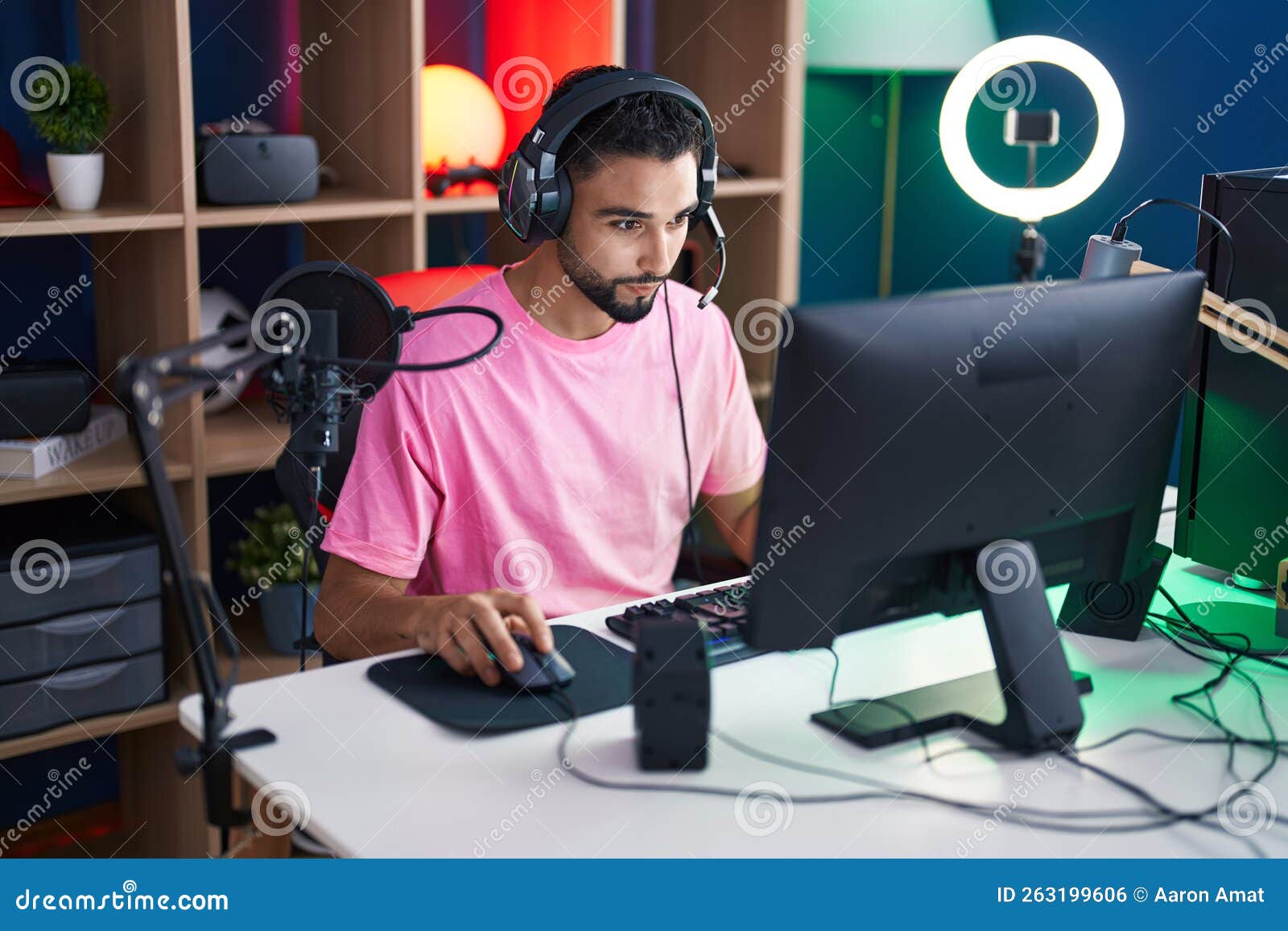 Young Arab Man Streamer Playing Video Game Using Computer at Gaming ...