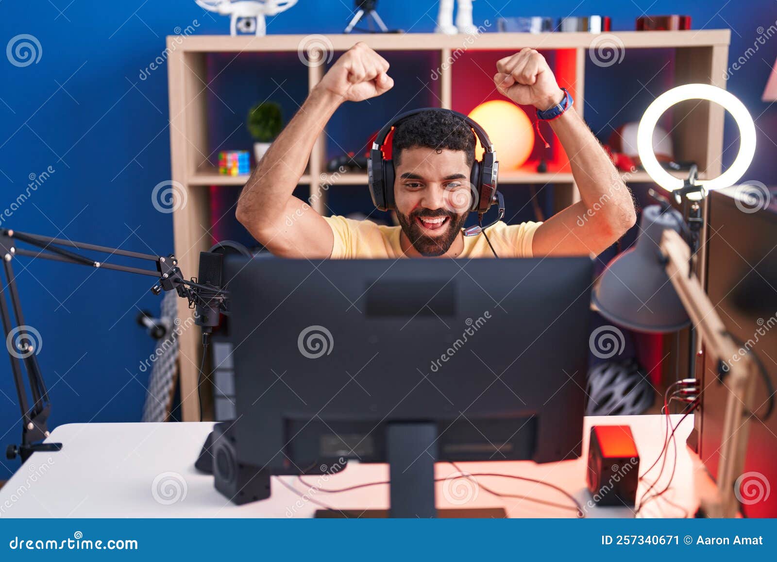 Young Arab Man Streamer Playing Video Game with Winner Expression at ...