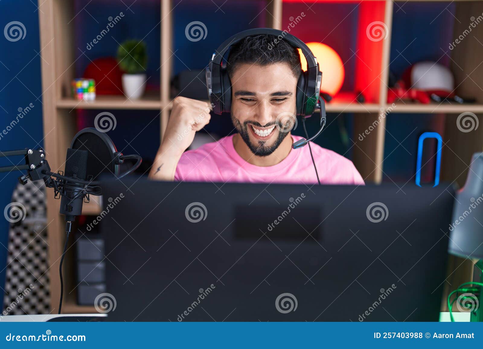 Young Arab Man Streamer Playing Video Game with Winner Expression at ...