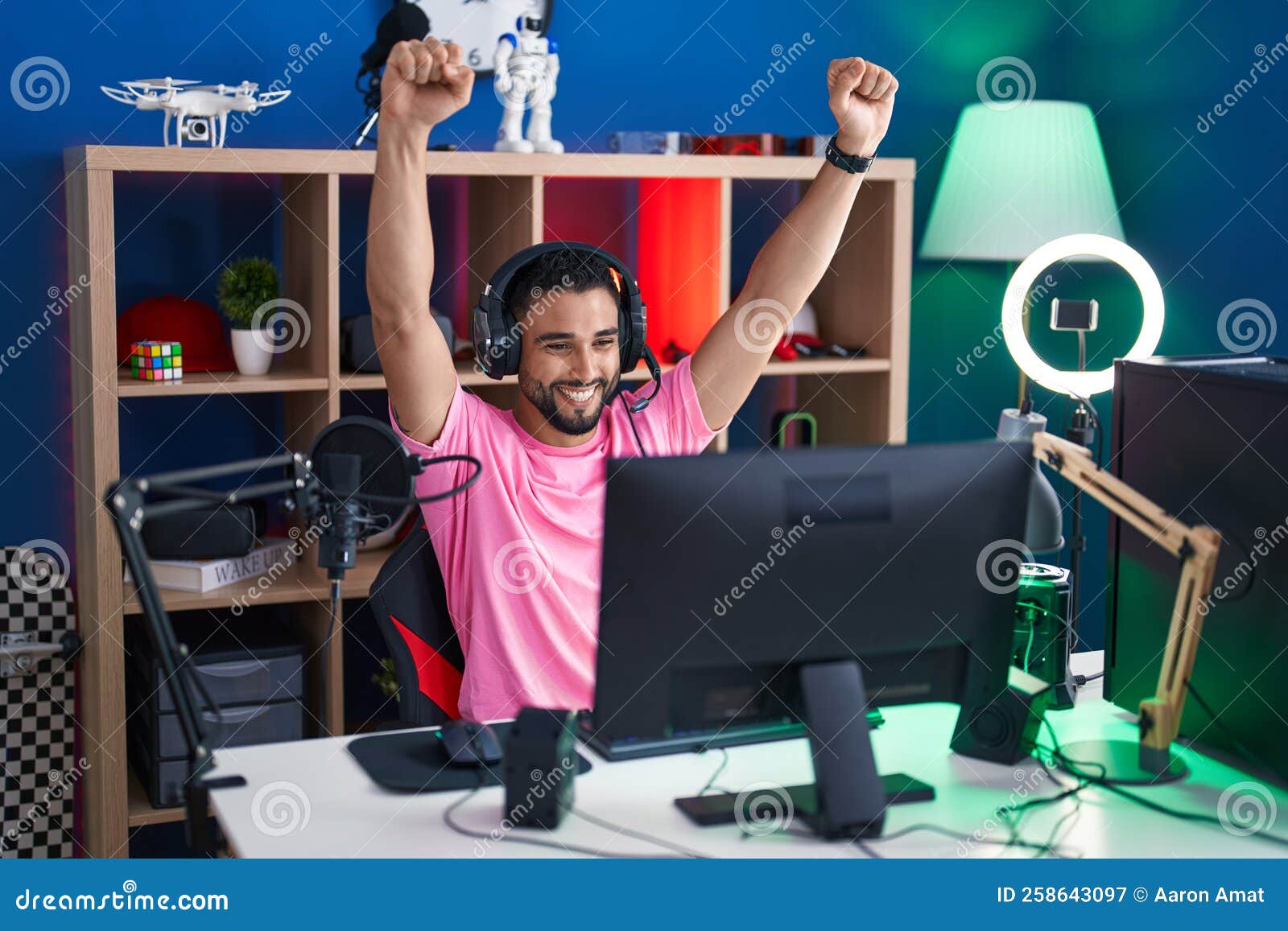 Young Arab Man Streamer Playing Video Game with Winner Expression at ...
