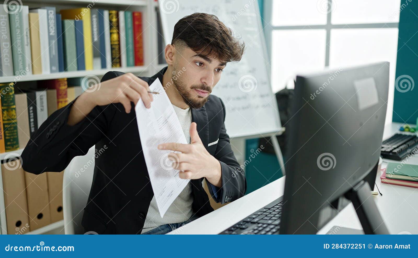Young Arab Man Student Having Video Call Showing Document at University ...