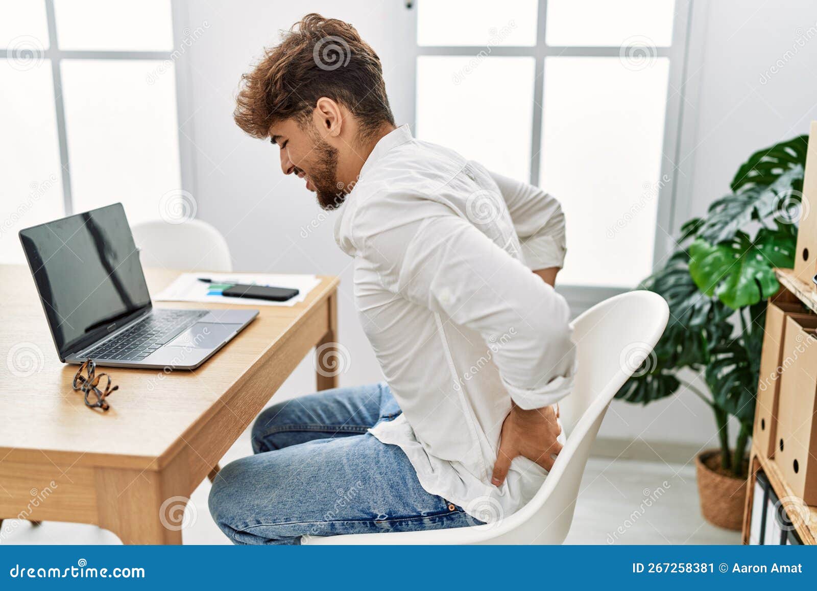 Young Arab Man Suffering for Back Pain Working at Office Stock Image ...