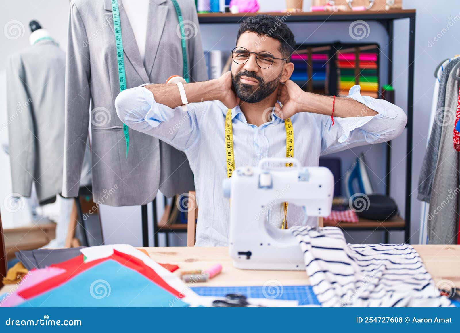 Young Arab Man Tailor Stressed Using Sewing Machine at Tailor Shop ...
