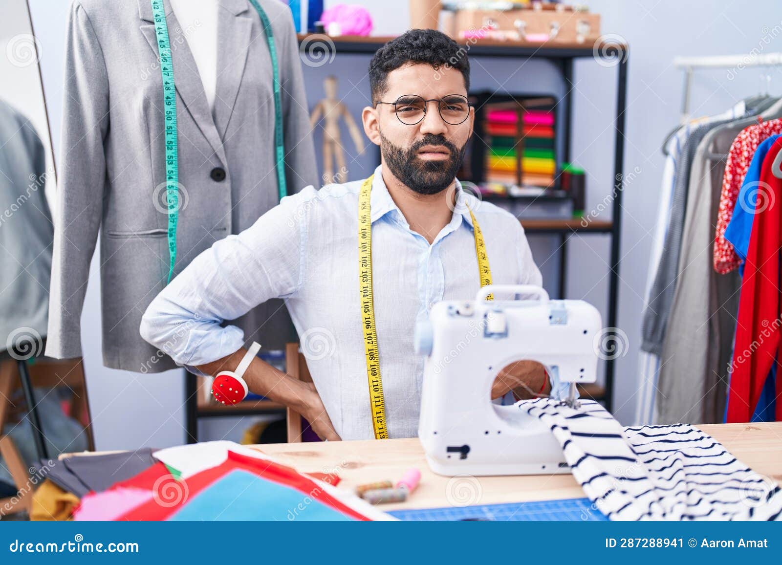 Young Arab Man Tailor Stressed Using Sewing Machine at Tailor Shop ...