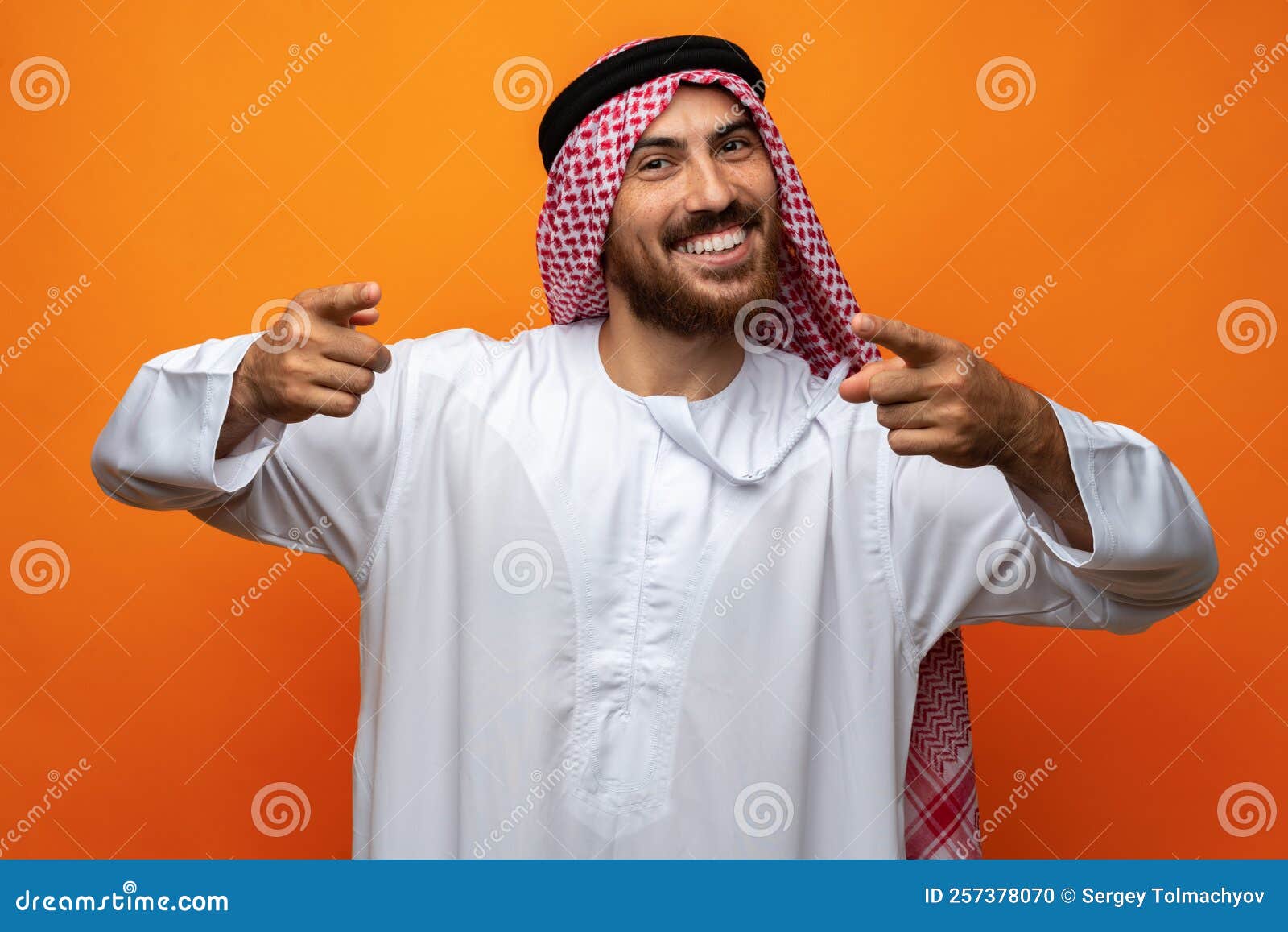 Young Arab Man in Traditional Clothing Pointing on You on Orange ... Young Arab Man in Traditional Clothing Pointing on You on Orange ...
